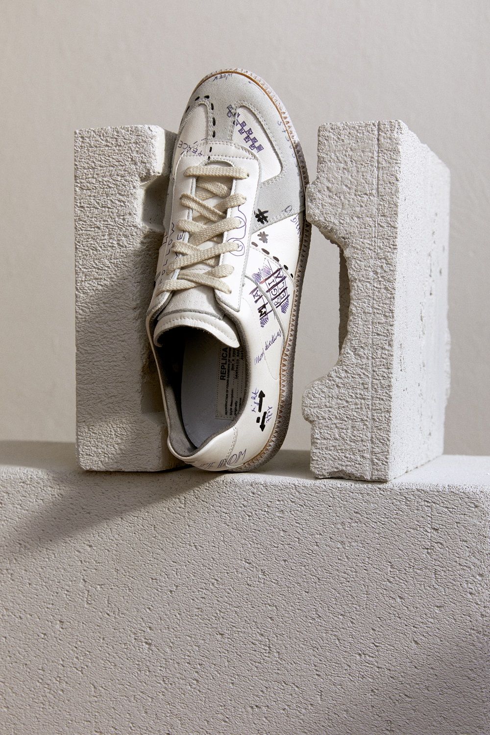 Maison Margiela's 'Vintage Graffiti' Replica sneaker x Mytheresa Maison Margiela's 'Vintage Graffiti' Replica sneaker x Mytheresa